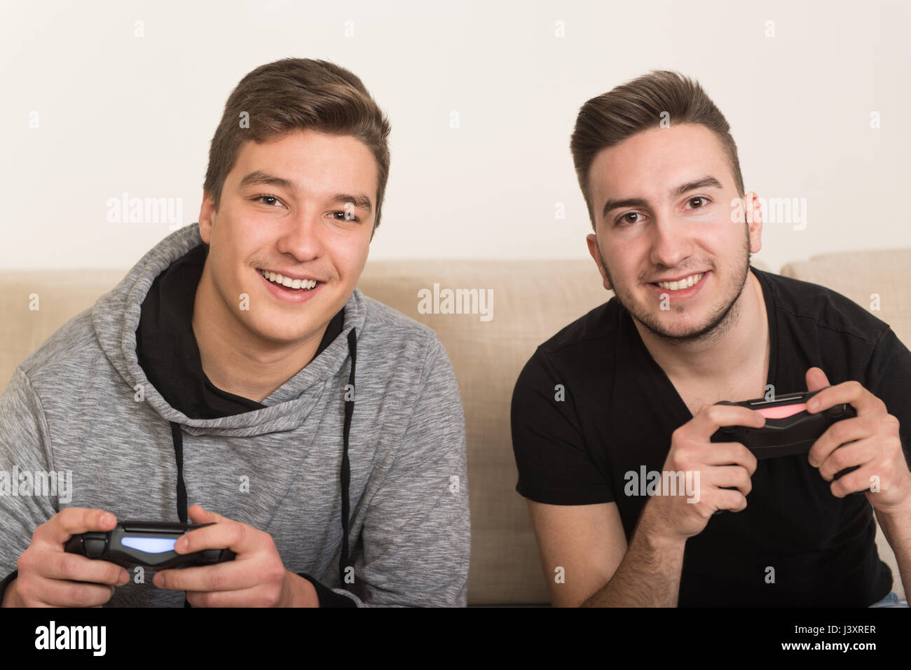 Two guys playing video games hi-res stock photography and images - Alamy