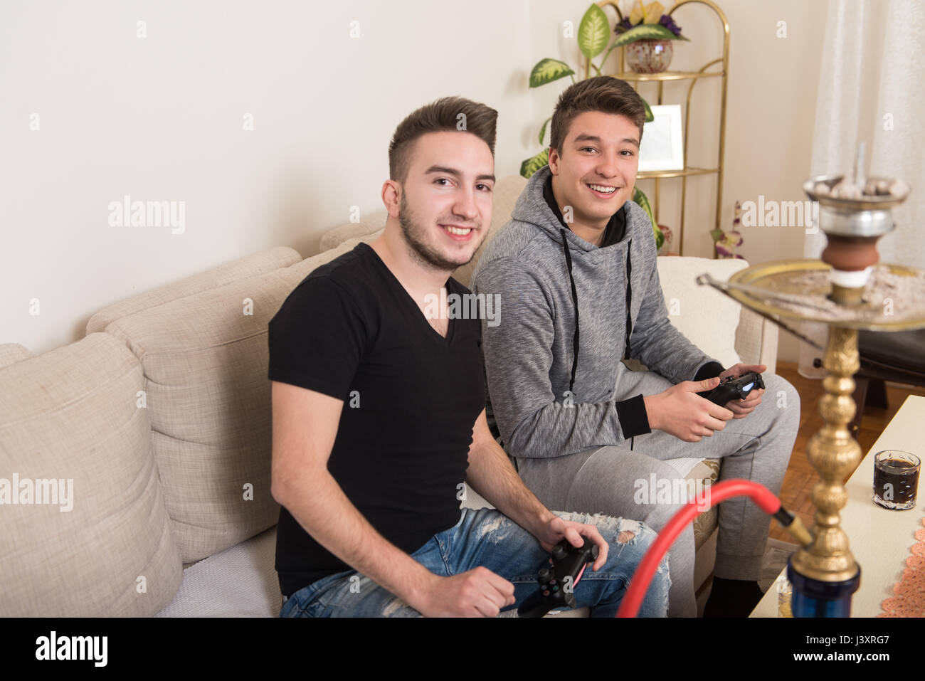 Two Guys Chilling And People Watching High Resolution Stock Photography ...