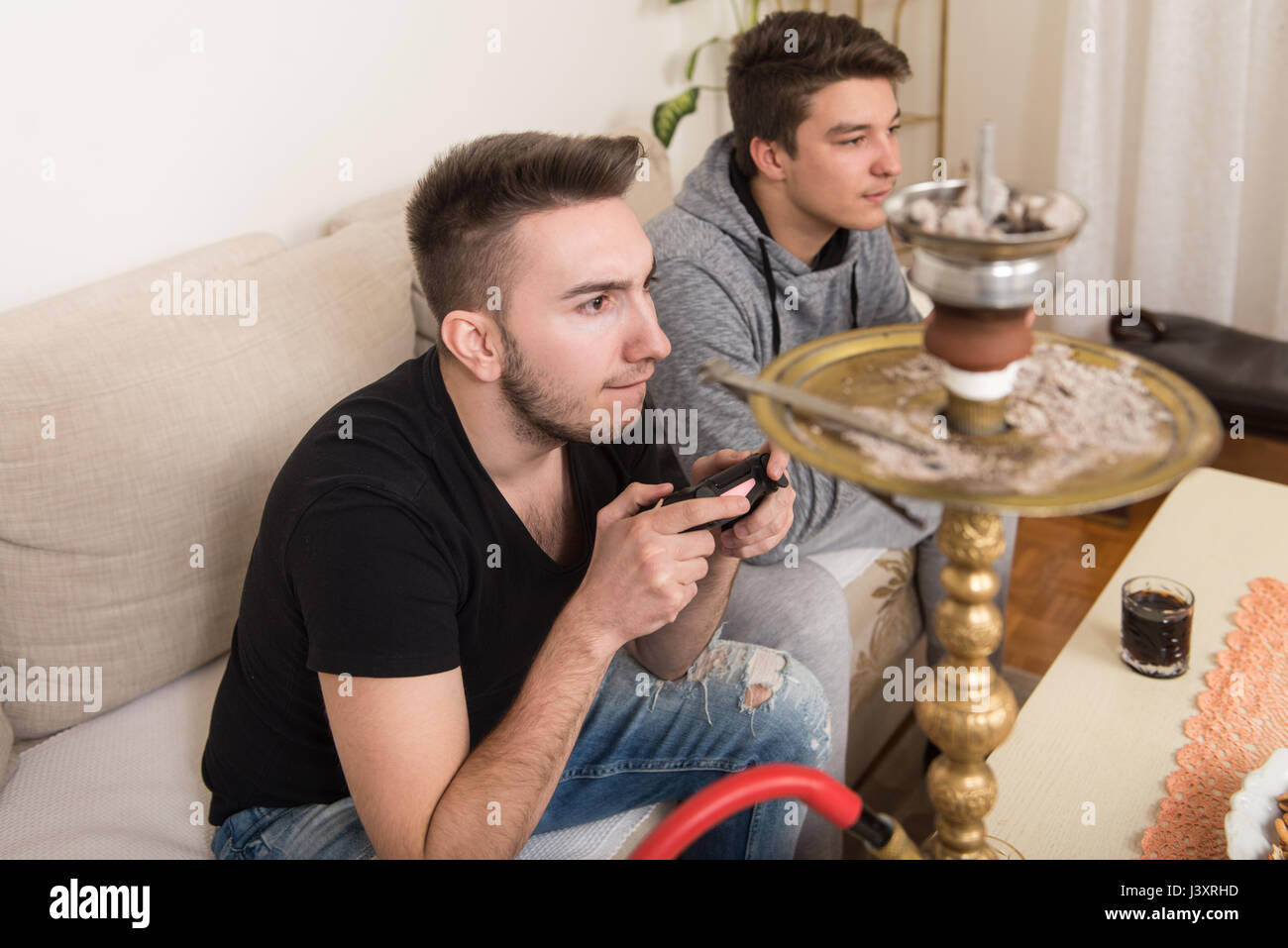 Two Guys Chilling And People Watching High Resolution Stock Photography ...