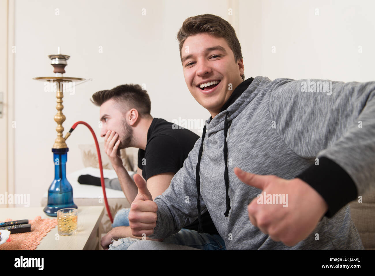 Two Guys Chilling And People Watching High Resolution Stock Photography ...