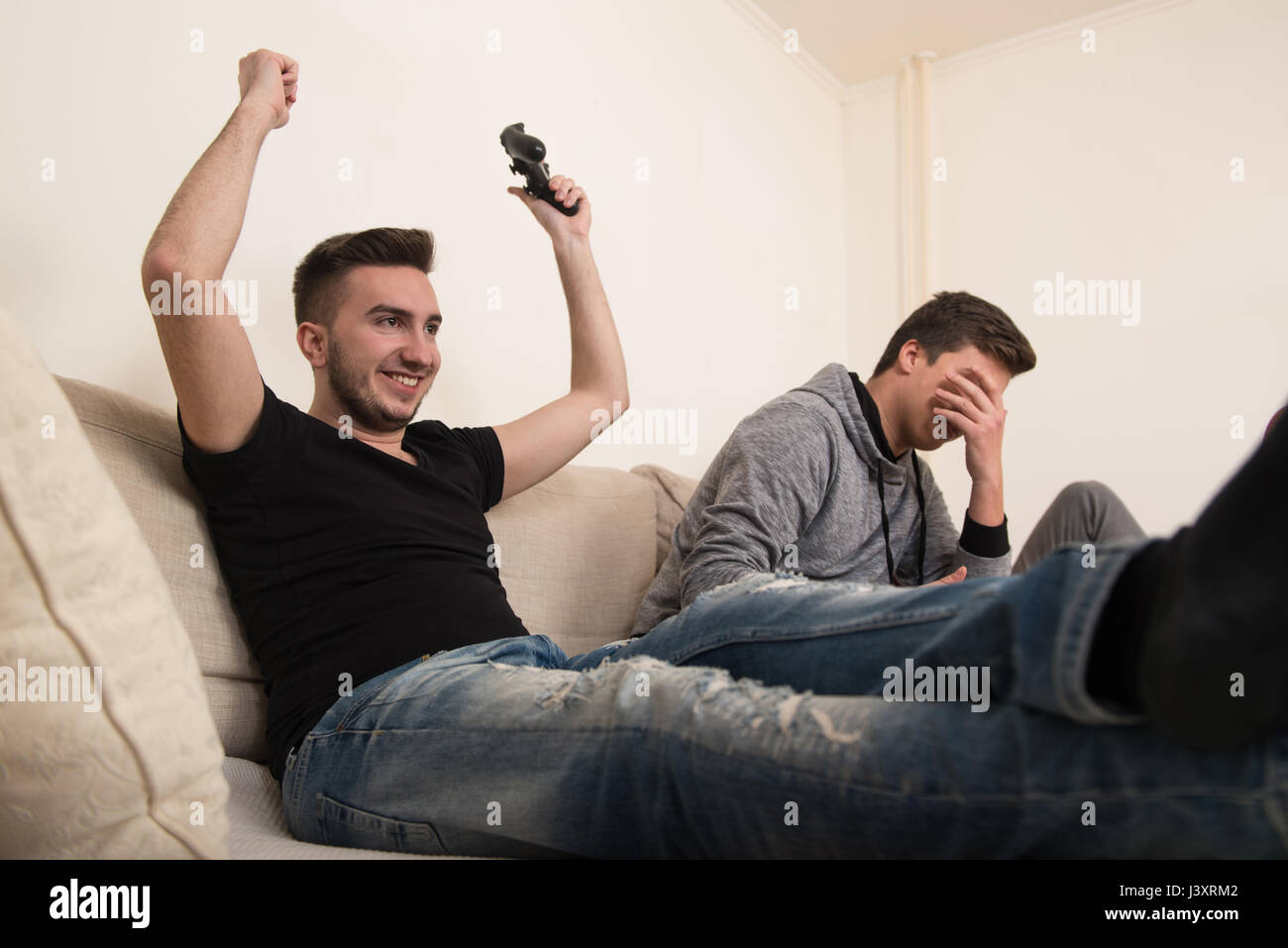 Two guys chilling and people watching hi-res stock photography and ...