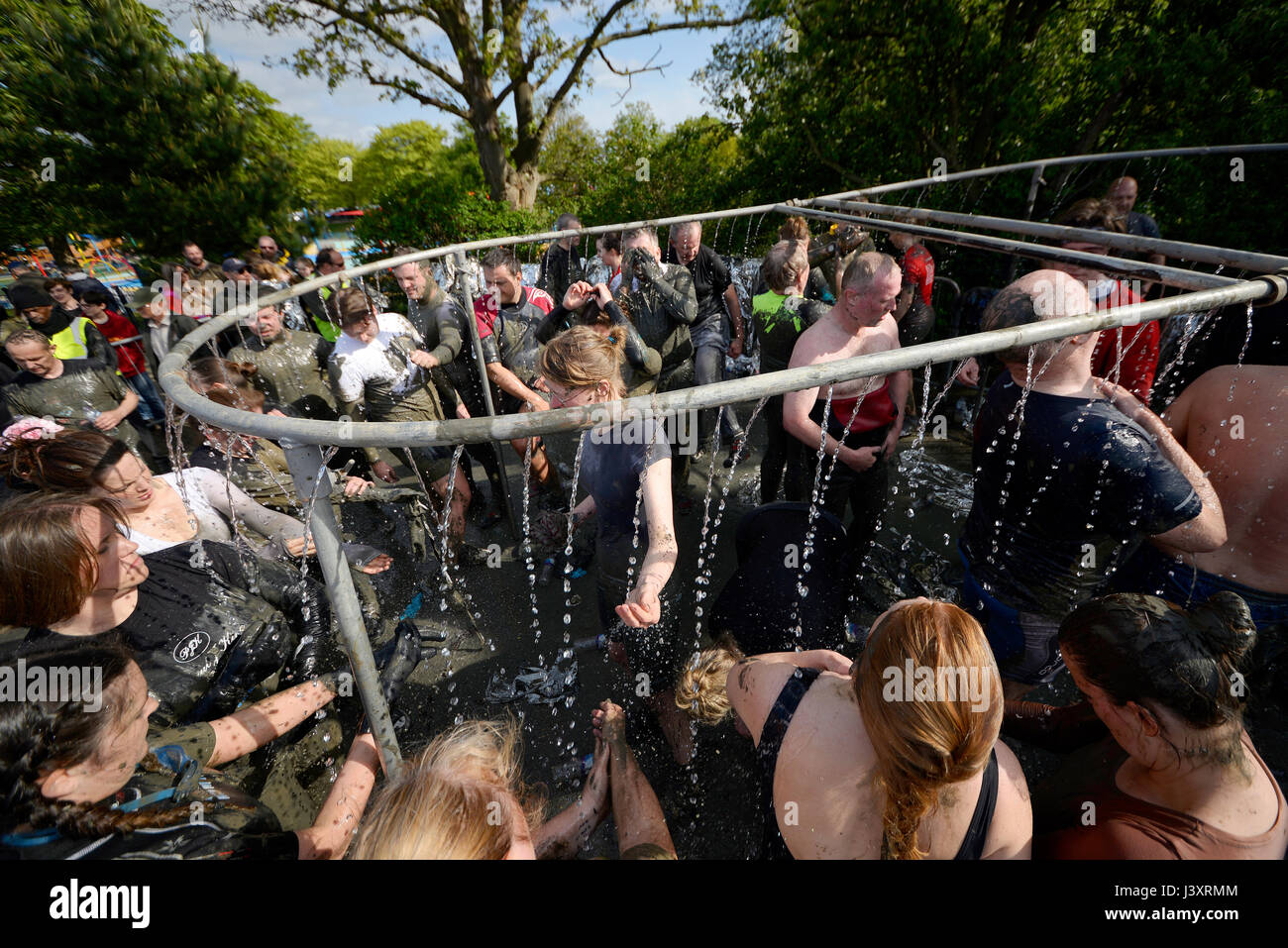 Mad Maldon Mud Race competitors showering off the mud from racing ...
