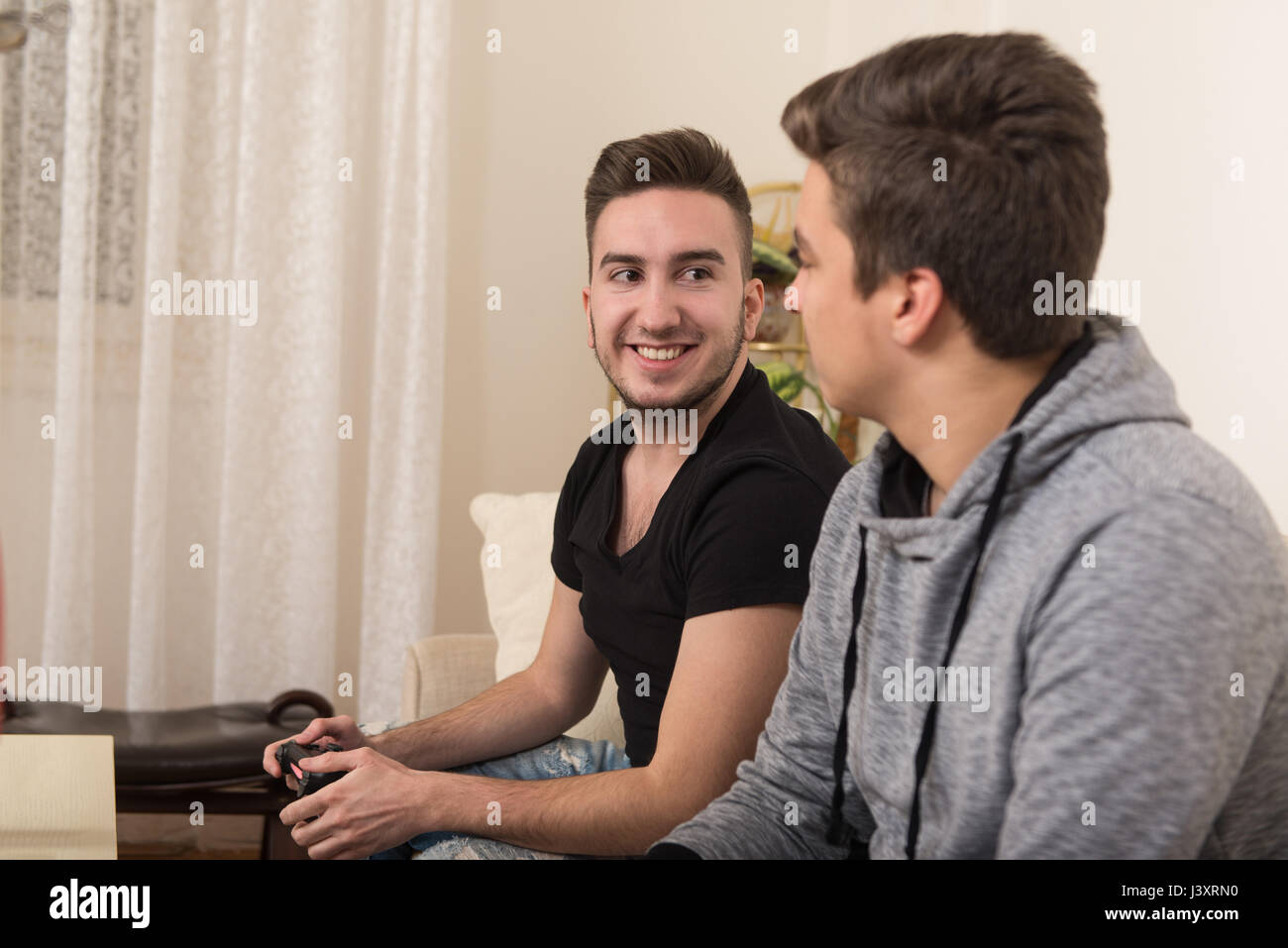Two Men Competitive Friends Playing Video Games and Excited Happy ...