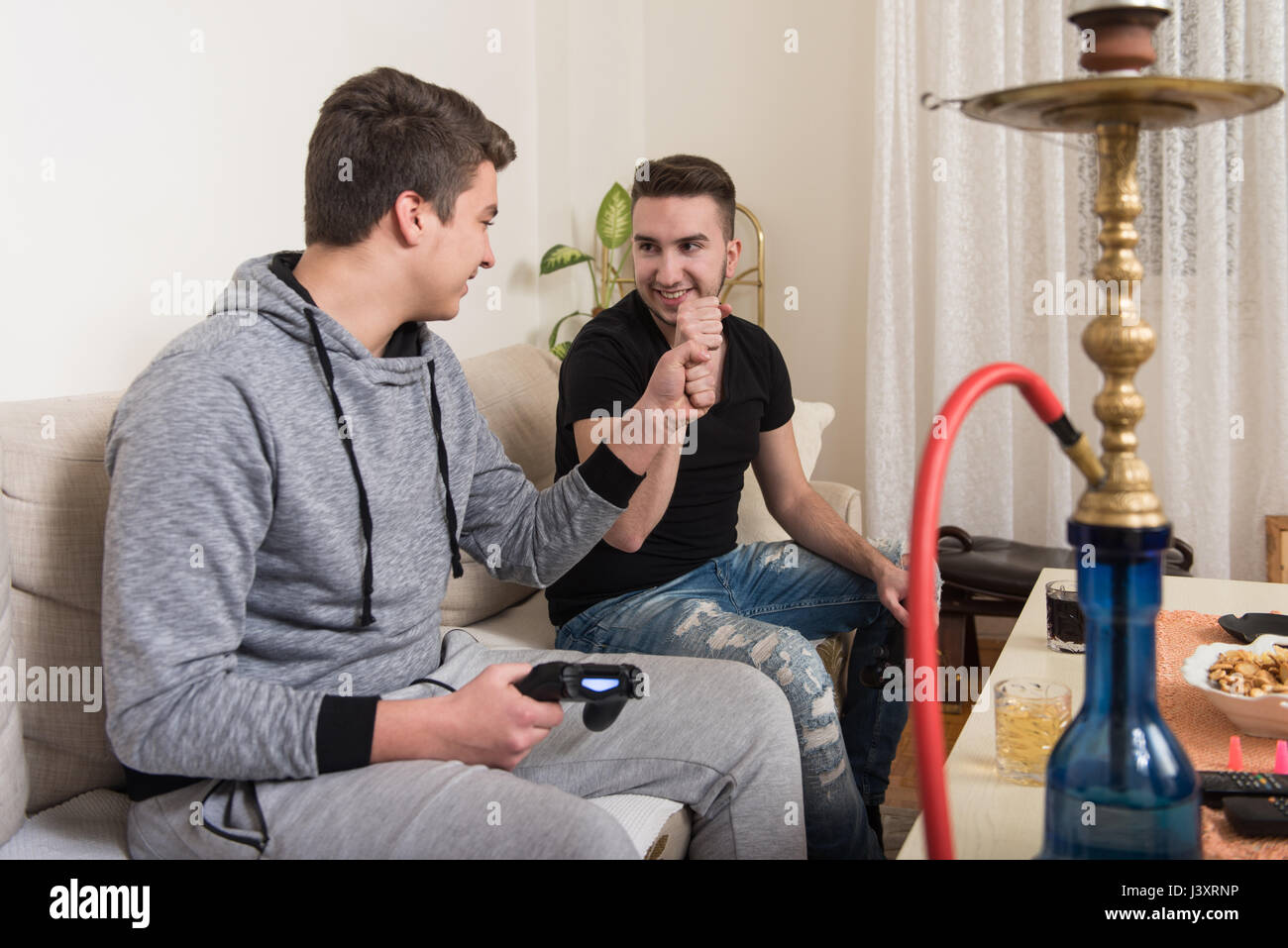 Two Men Competitive Friends Playing Video Games and Excited Happy ...