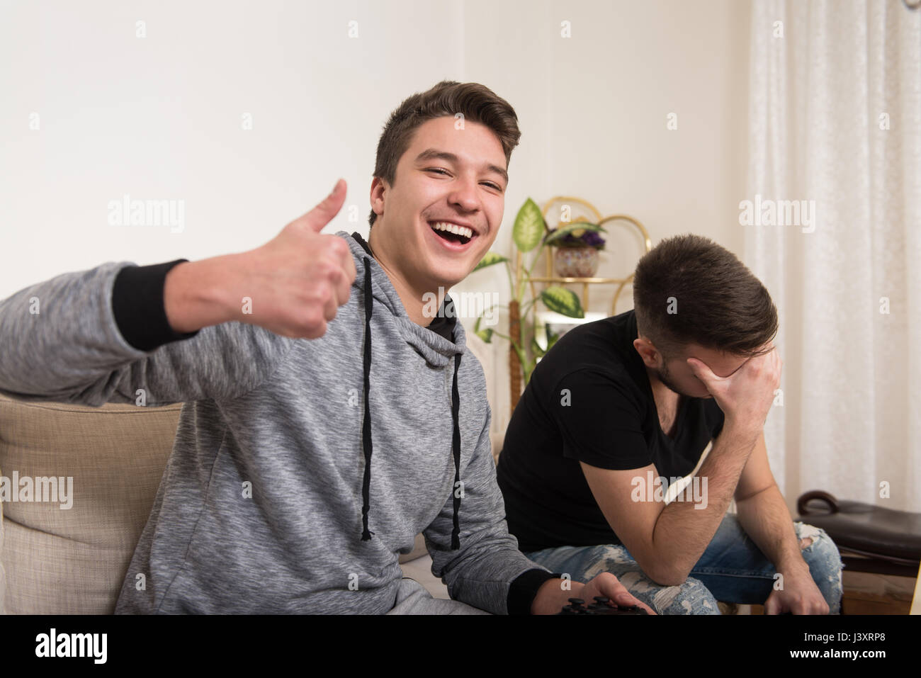 Two guys chilling and people watching hi-res stock photography and ...