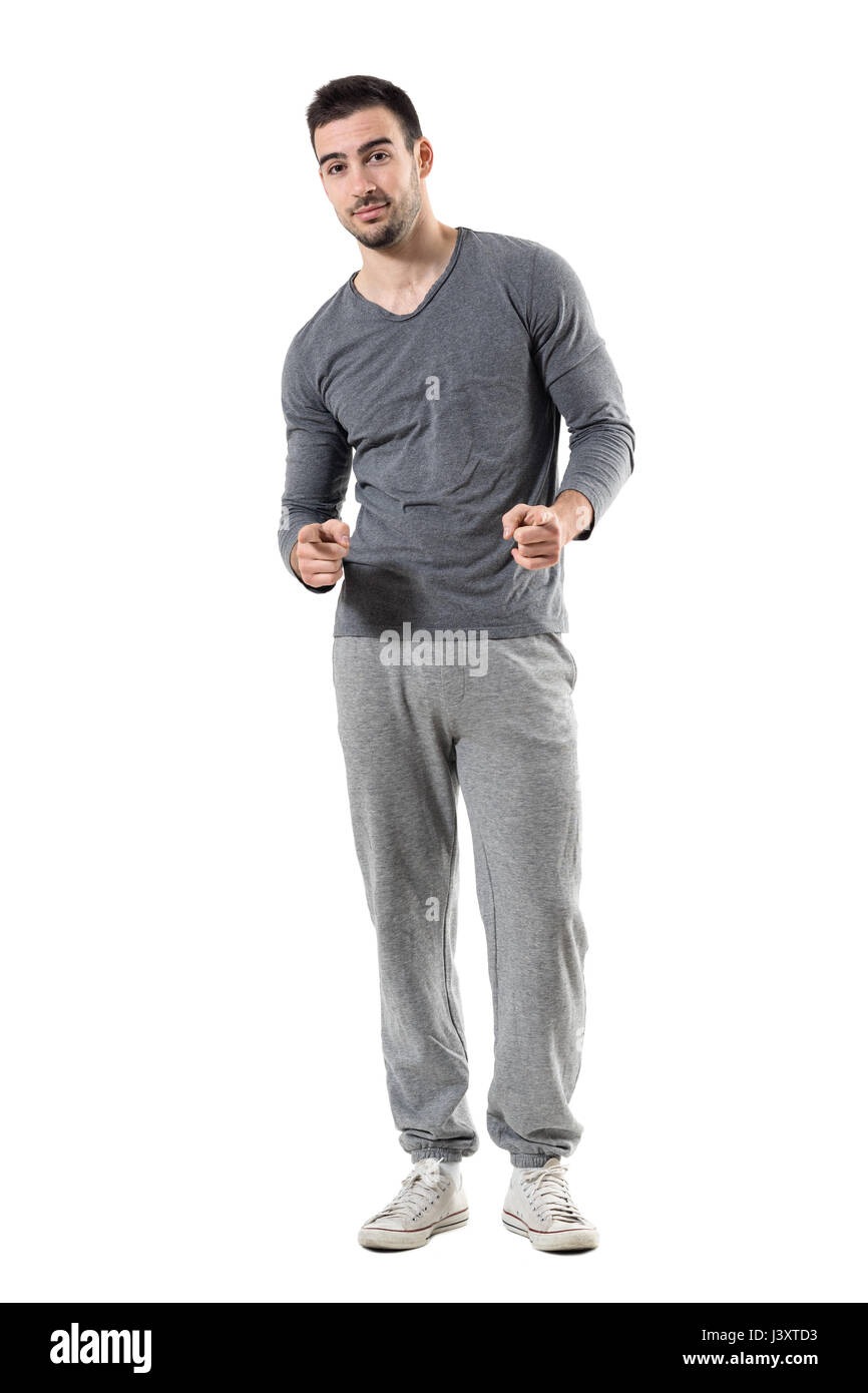 Happy young fit sporty athletic man pointing finger choosing you. Full ...