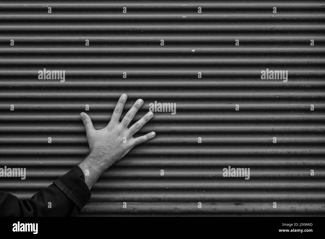 View of a hand against the textured wall Stock Photo - Alamy