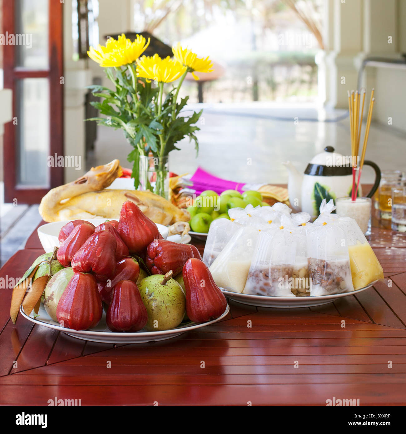 Traditional, ceremonial Asian food, fruits desserts, duck, rice on the ...