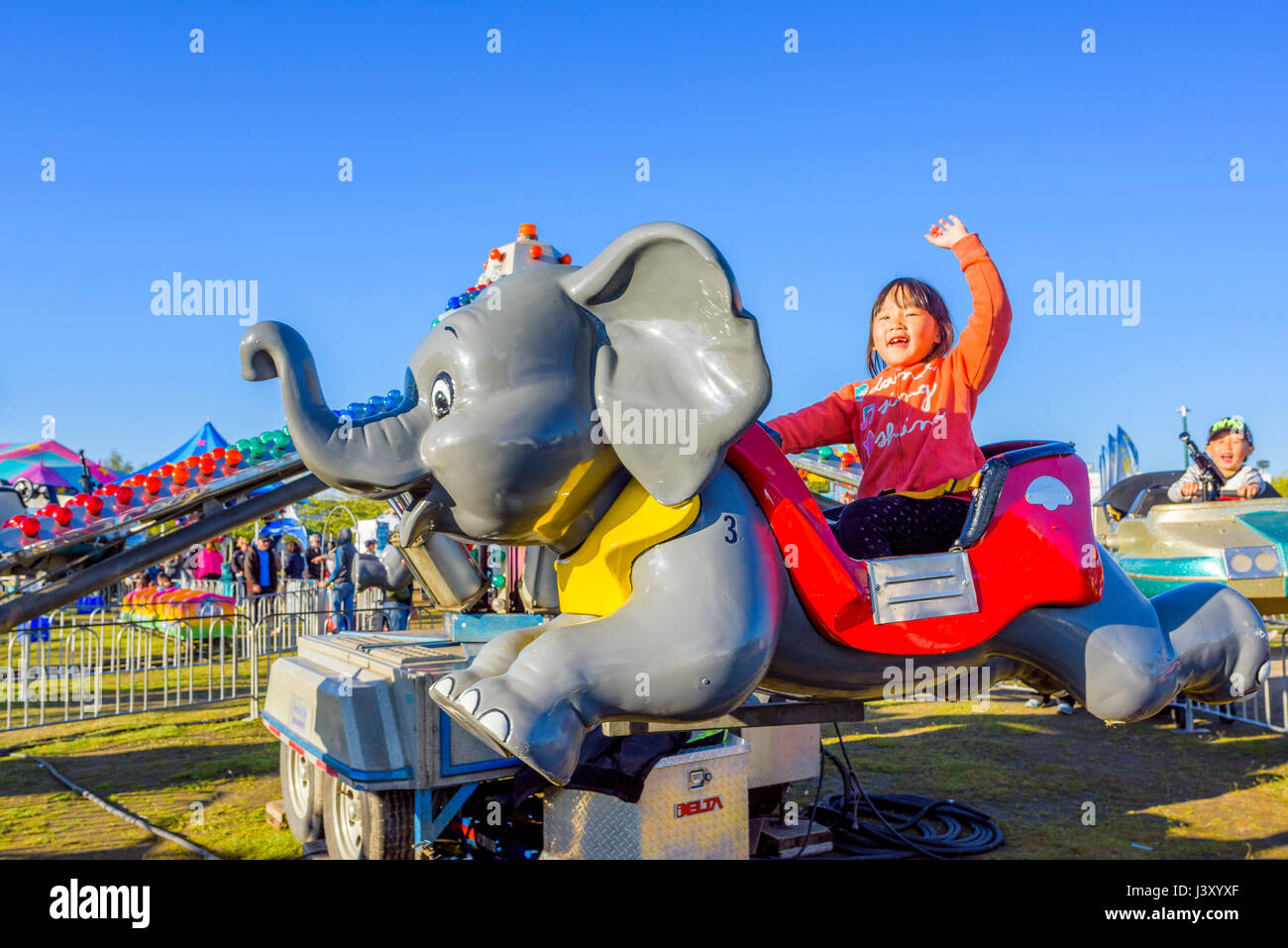Girl on Carnival Fun Fair Ride Stock Photo - Alamy