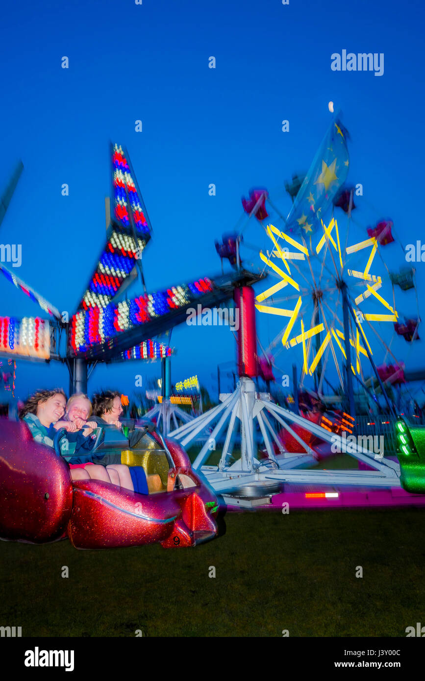 Kids on Carnival Fun Fair Ride Stock Photo - Alamy