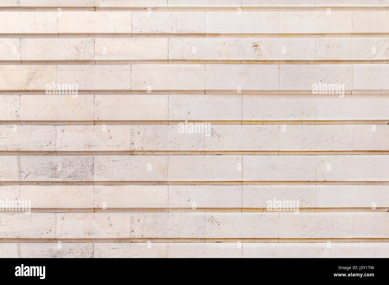 Big light yellow stone building wall texture Stock Photo - Alamy