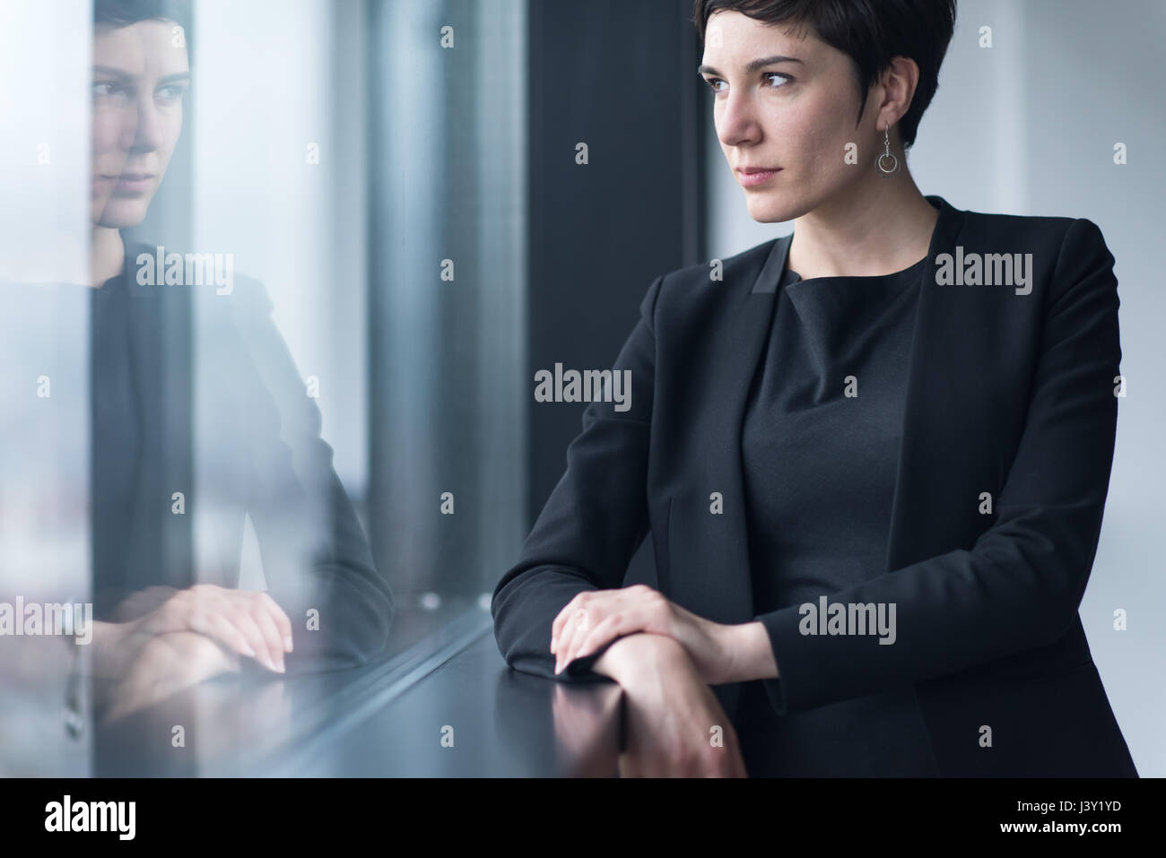 Portrait Of Successful Businesswoman by the window Entrepreneur At Busy ...