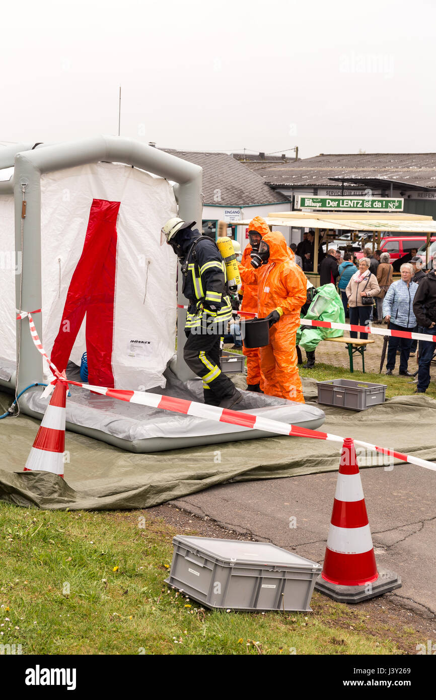 Fireman demonstrate how to handle hazardous material - public ...
