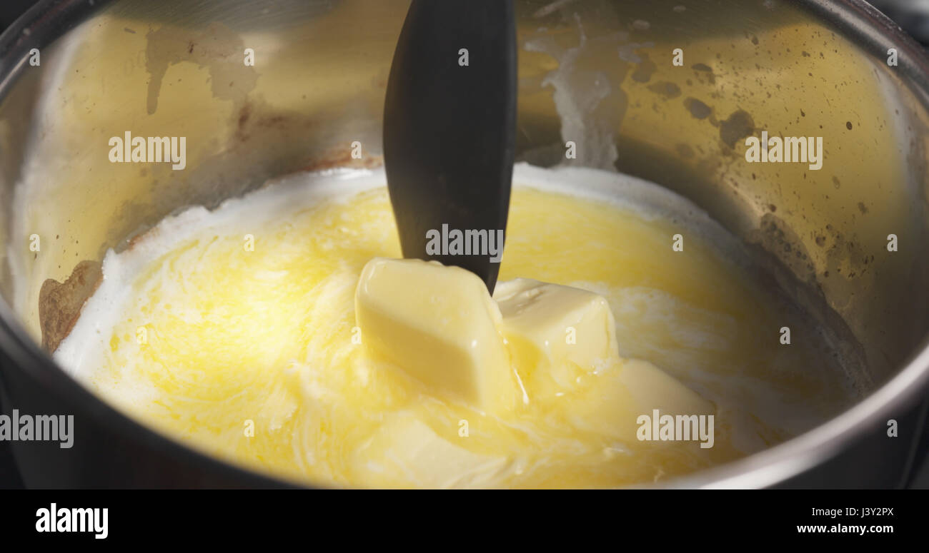 melting and mixing butter in milk Stock Photo - Alamy