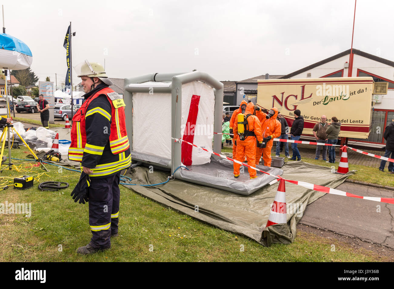 Fireman demonstrate how to handle hazardous material - public ...