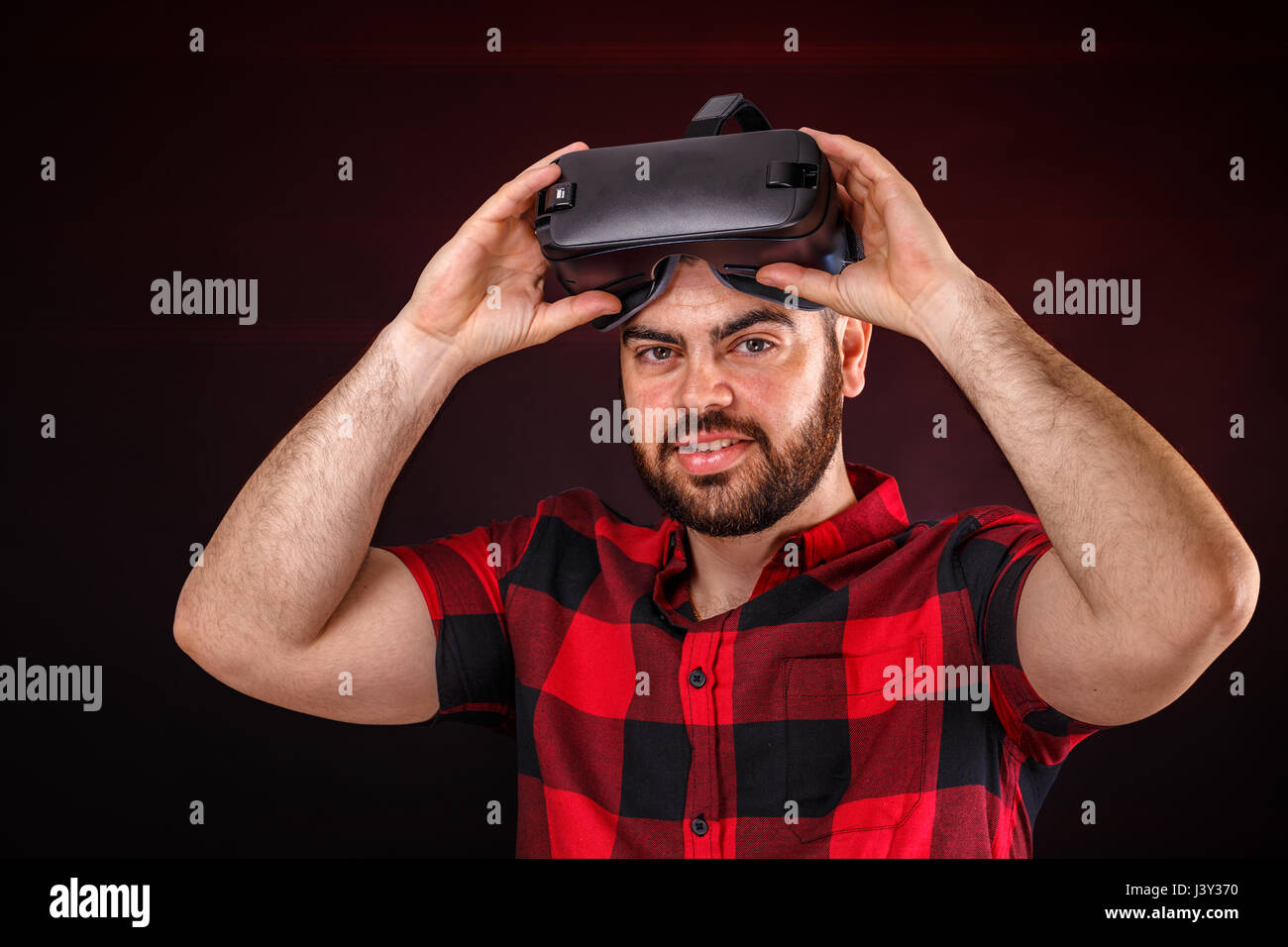 Young man using VR glasses headset Stock Photo - Alamy