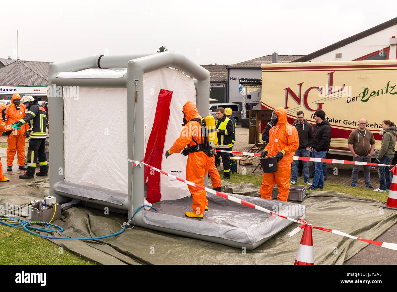 Fireman demonstrate how to handle hazardous material - public ...