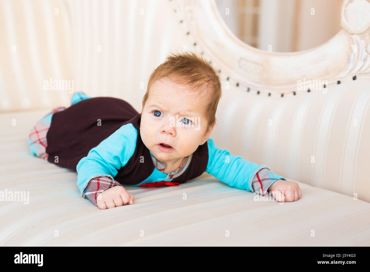adorable baby boy lying on tummy Stock Photo - Alamy