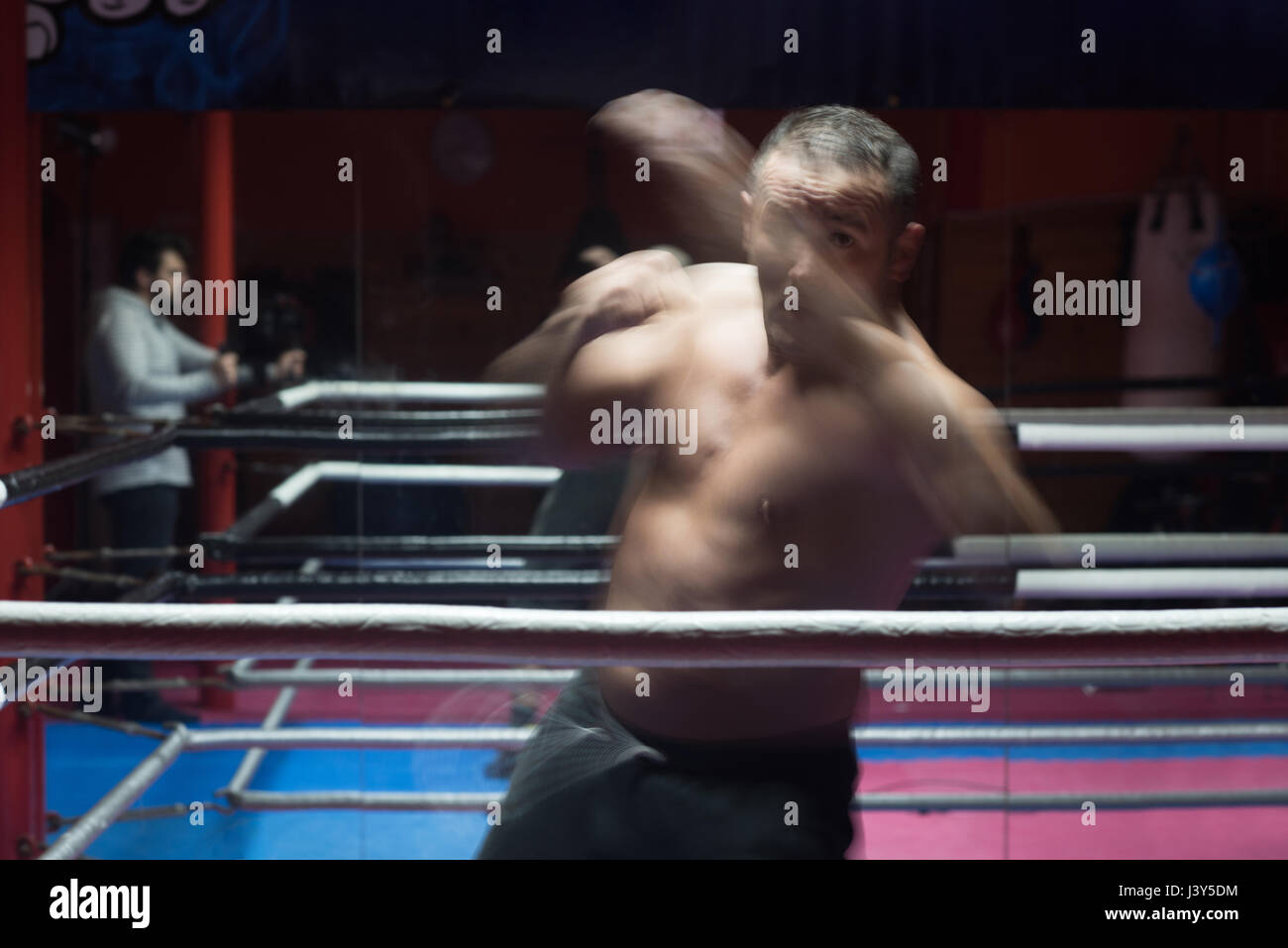 professional kickboxer with hands in martial arts position training for ...