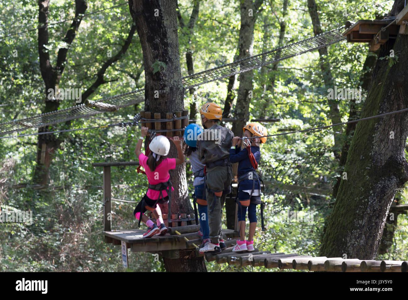 Children game in an adventure park Stock Photo - Alamy