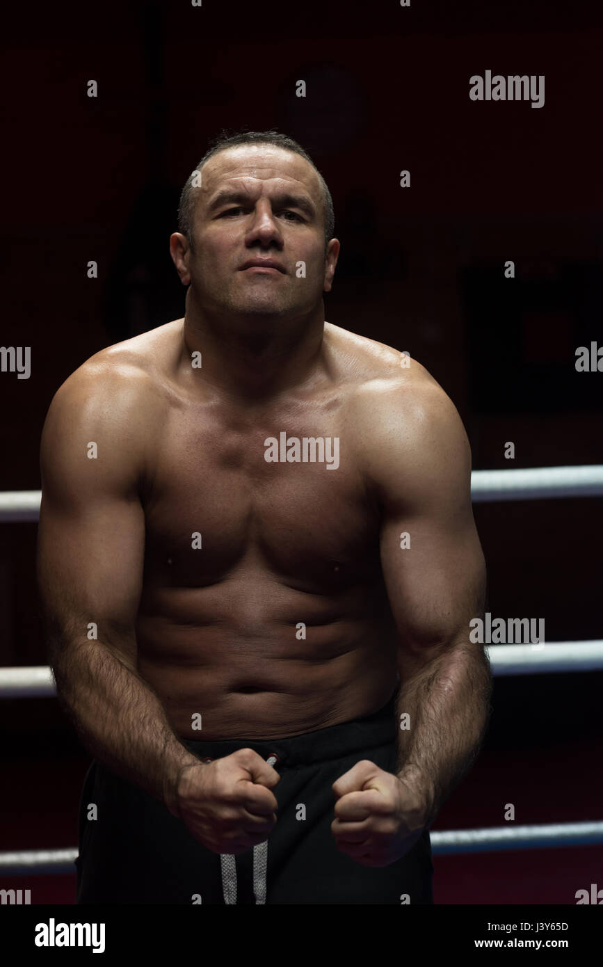 professional kickboxer with hands in martial arts position training for ...