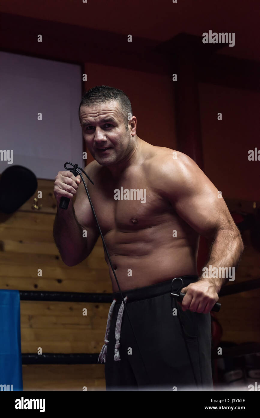 professional kickboxer with hands in martial arts position training for ...