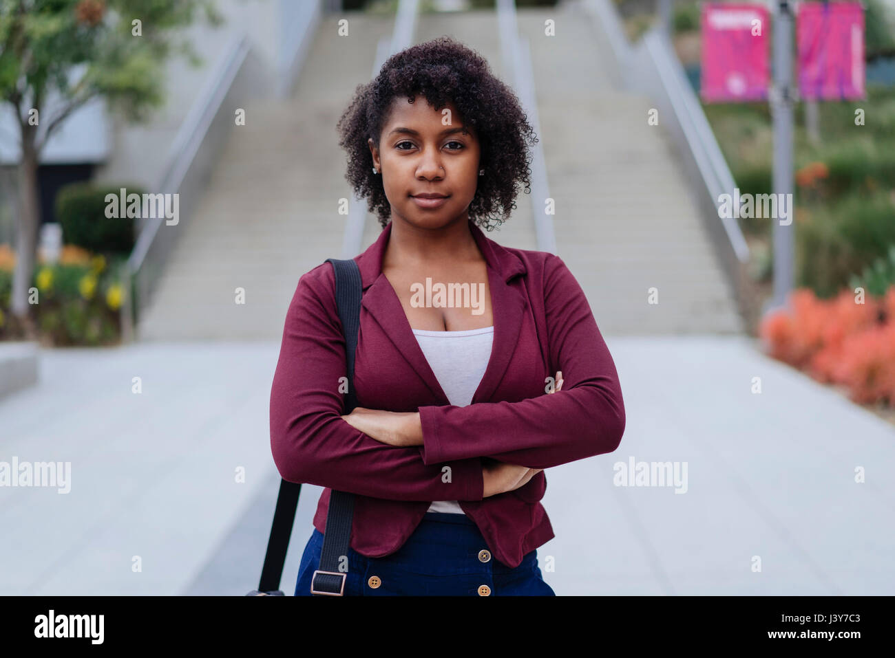 Woman standing arms folded hi-res stock photography and images - Alamy