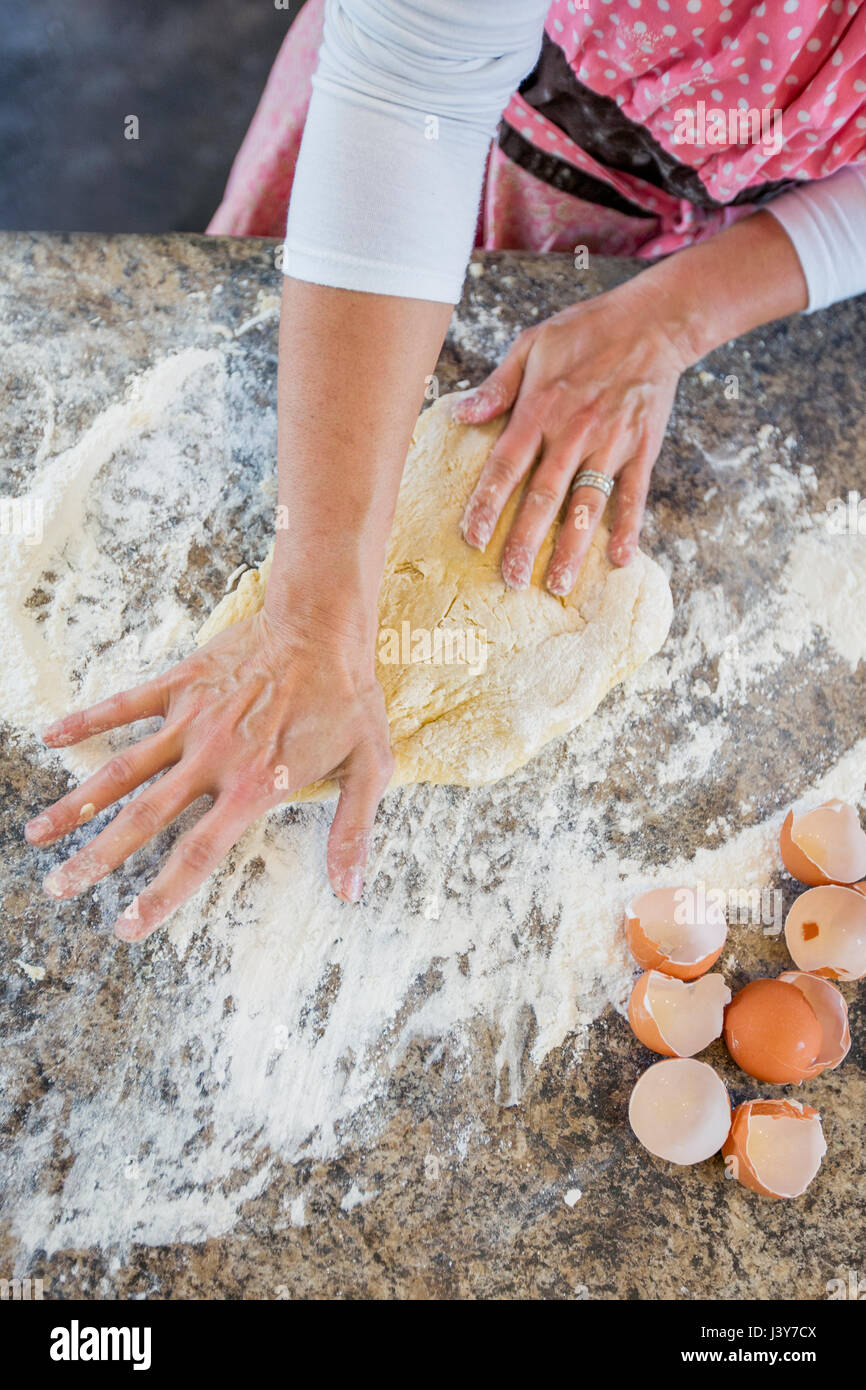 Mature woman making home made pasta, overhead view Stock Photo - Alamy