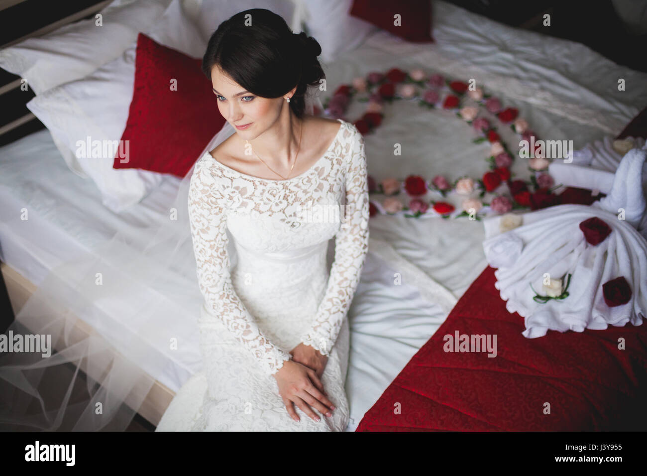 Bride sitting on bed hi-res stock photography and images - Alamy
