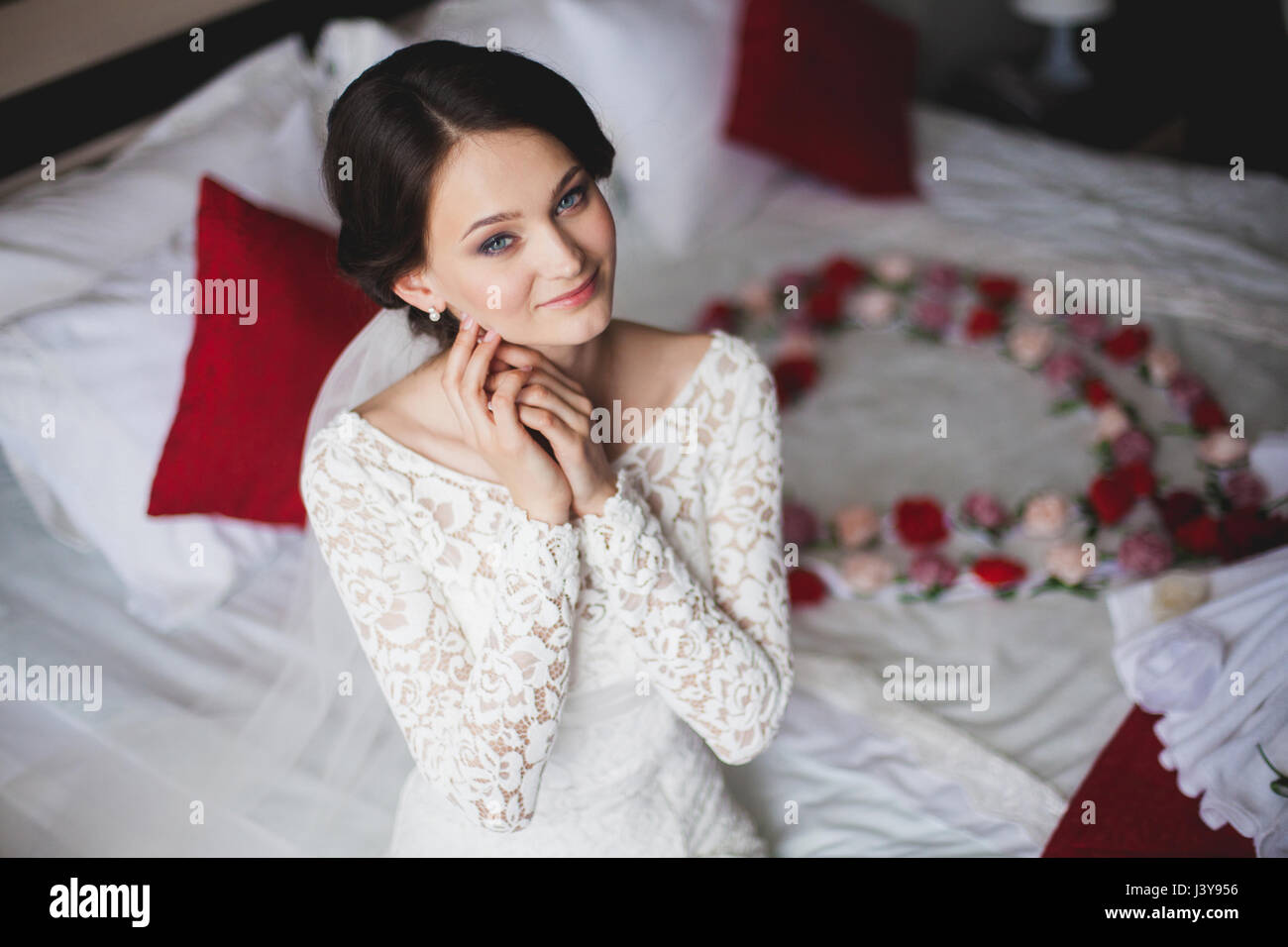 Bride sitting on bed hi-res stock photography and images - Alamy