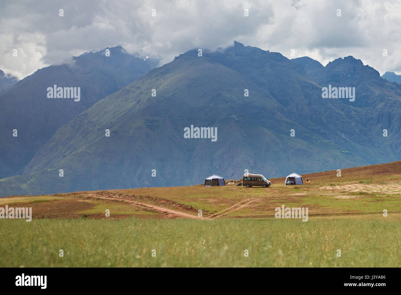 Camping in wild landscape with mountain background. Hiking camp in ...