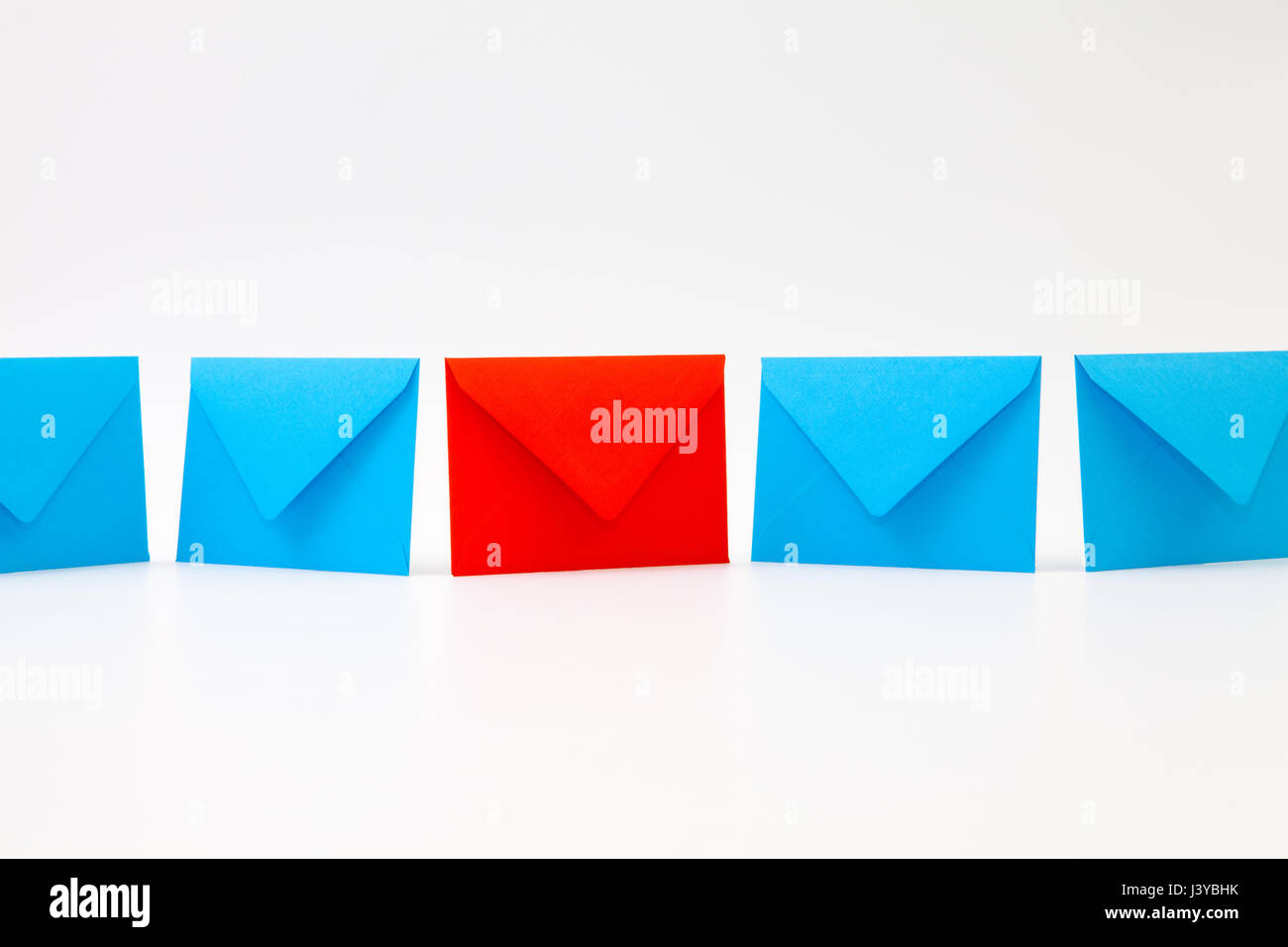 Different colored envelopes on the white background Stock Photo - Alamy