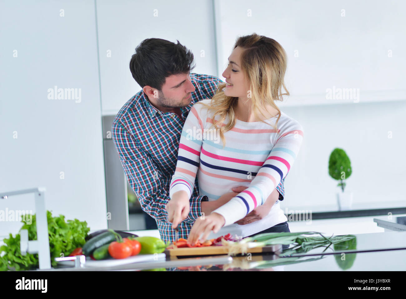 couple cooking healthy food in kitchen lifestyle meal preparation Stock ...