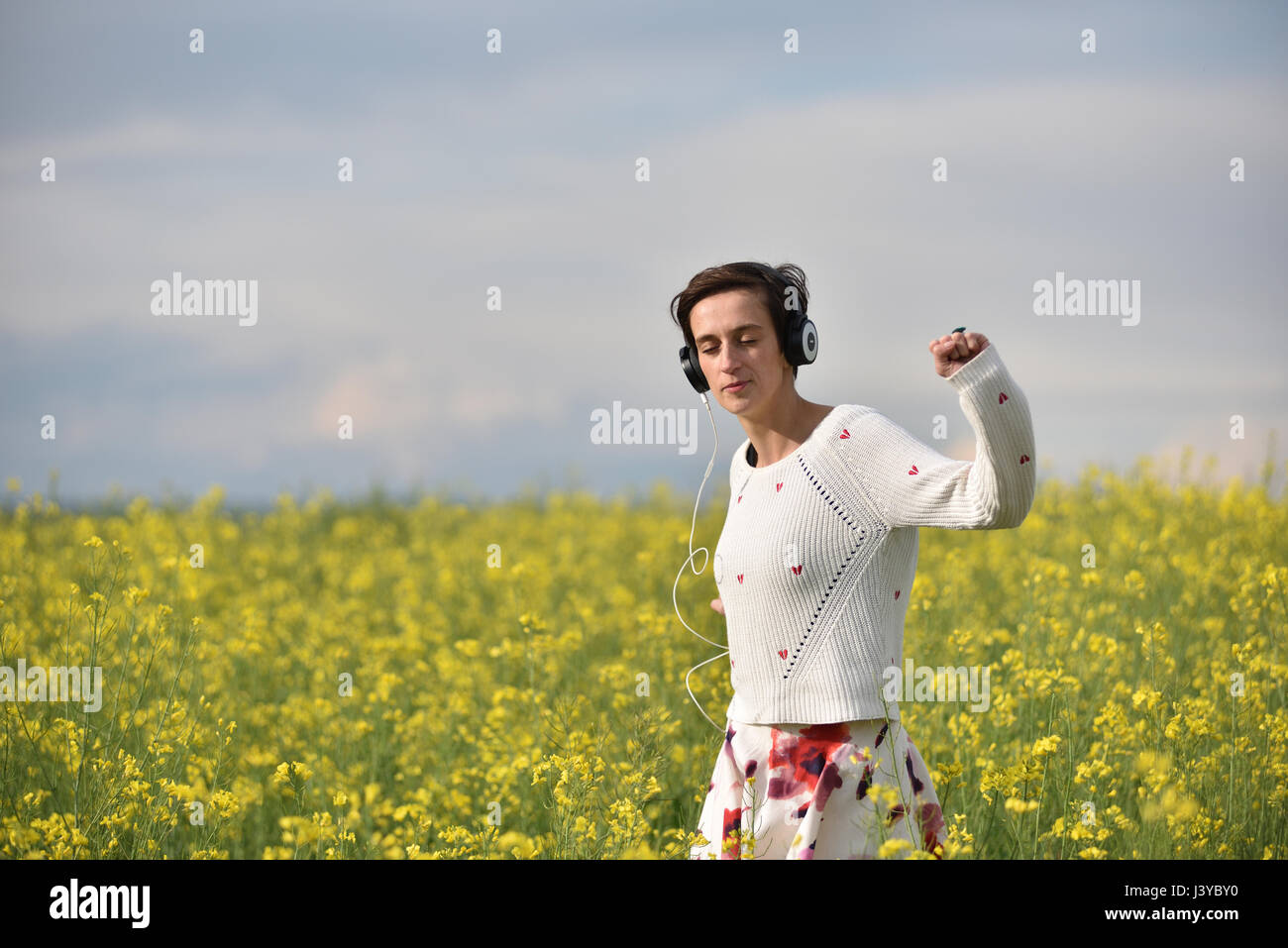 Portrait of happy smiling girl feeling free with music. Caucasian girl ...