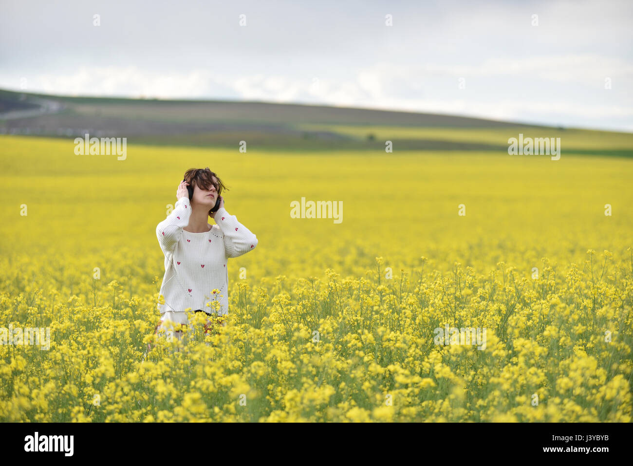 Portrait of happy smiling girl feeling free with music. Caucasian girl ...