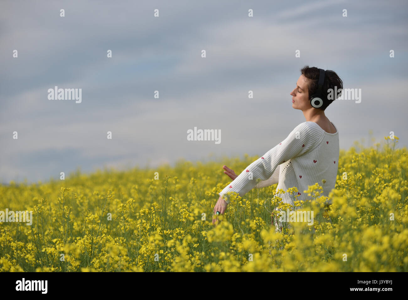 Portrait of happy smiling girl feeling free with music. Caucasian girl ...
