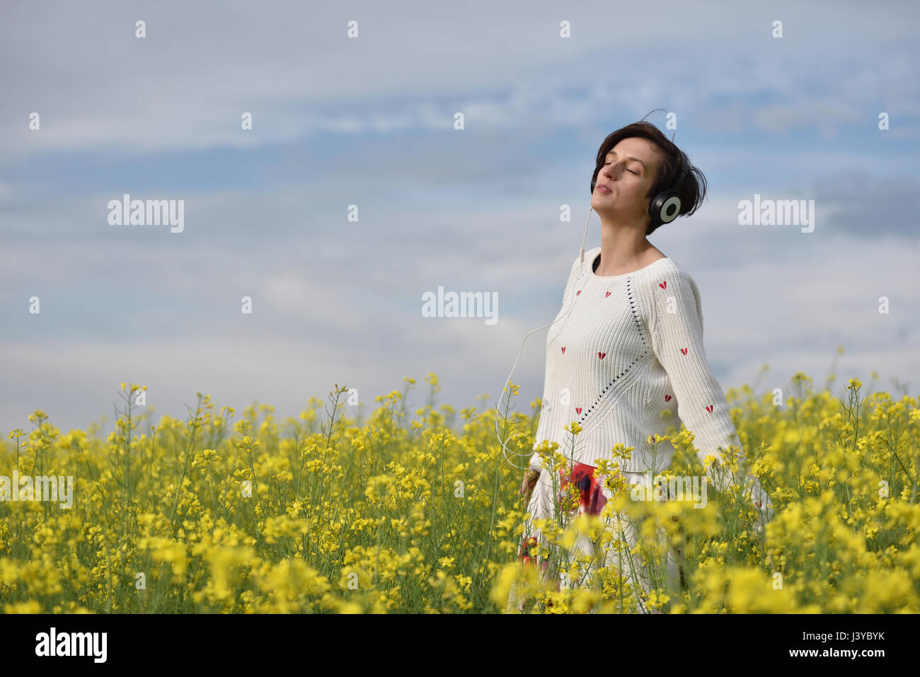Portrait of happy smiling girl feeling free with music. Caucasian girl ...