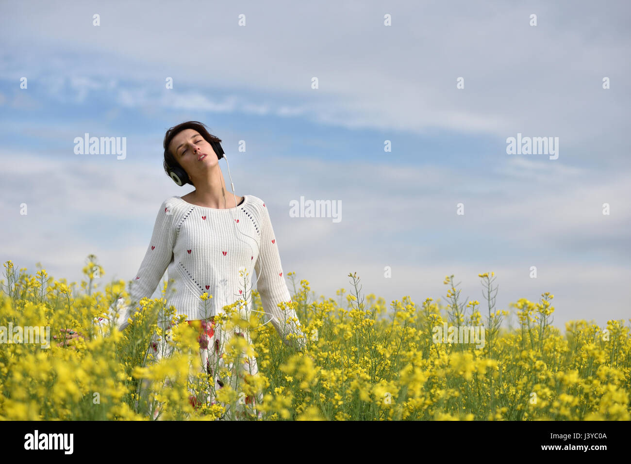 Portrait of happy smiling girl feeling free with music. Caucasian girl ...