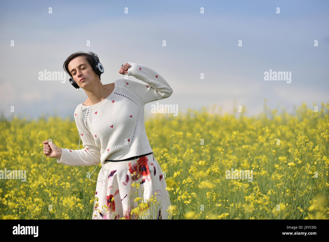 Portrait of happy smiling girl feeling free with music. Caucasian girl ...