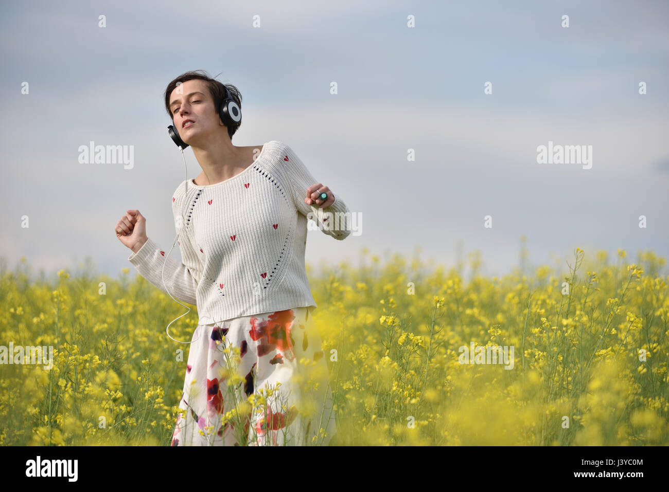 Portrait of happy smiling girl feeling free with music. Caucasian girl ...