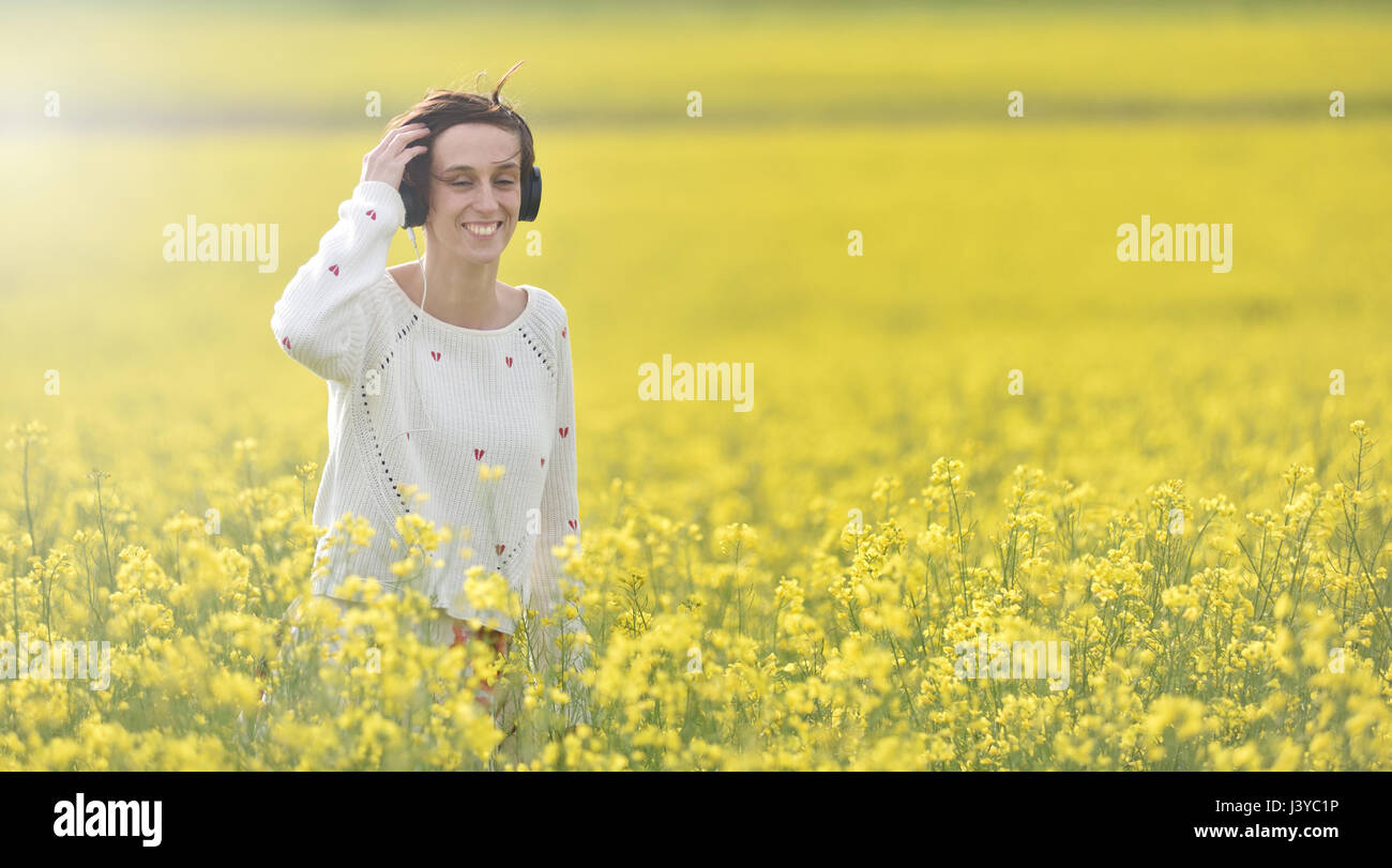 Portrait of happy smiling girl feeling free with music. Caucasian girl ...