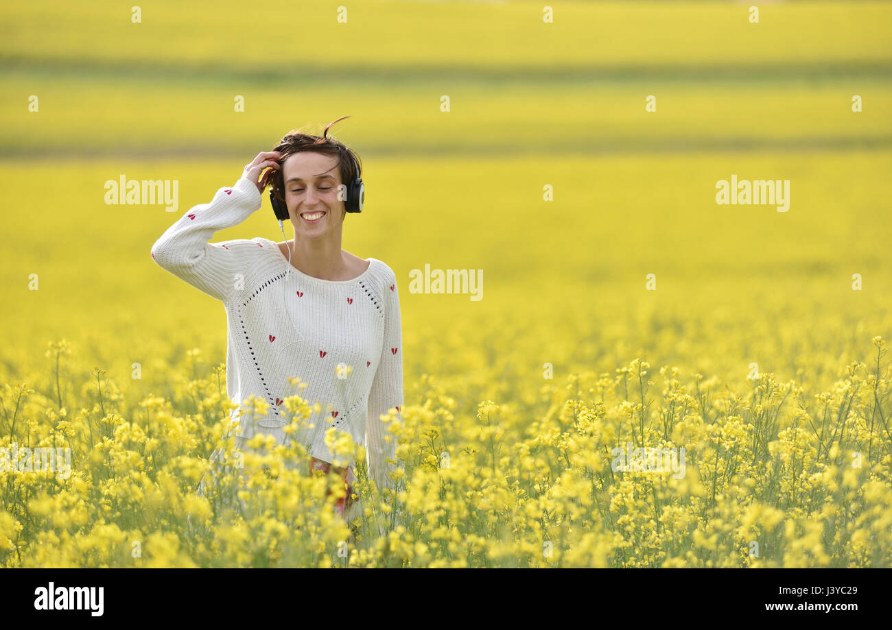 Portrait of happy smiling girl feeling free with music. Caucasian girl ...