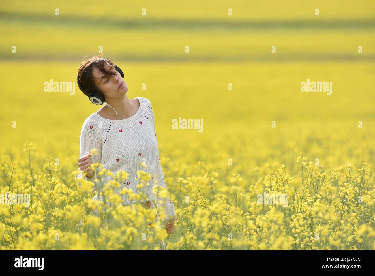 Portrait of happy smiling girl feeling free with music. Caucasian girl ...