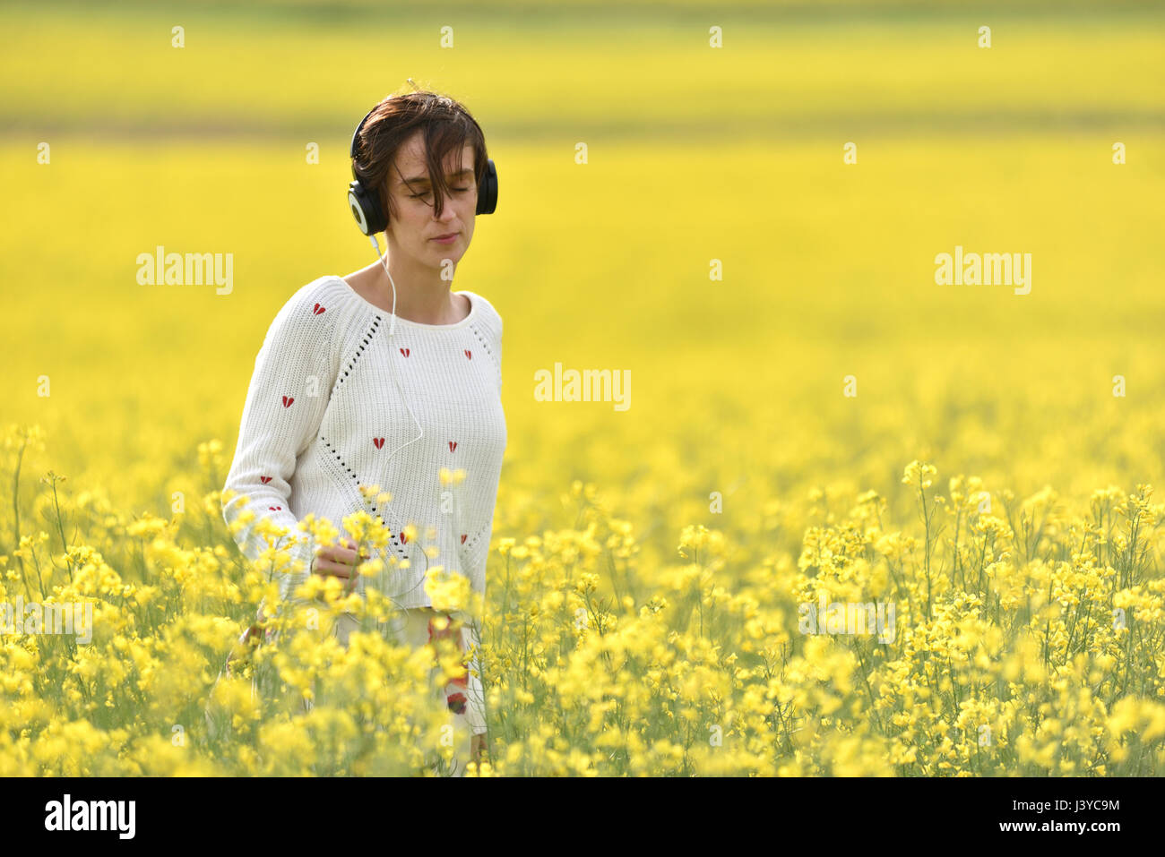 Portrait of happy smiling girl feeling free with music. Caucasian girl ...