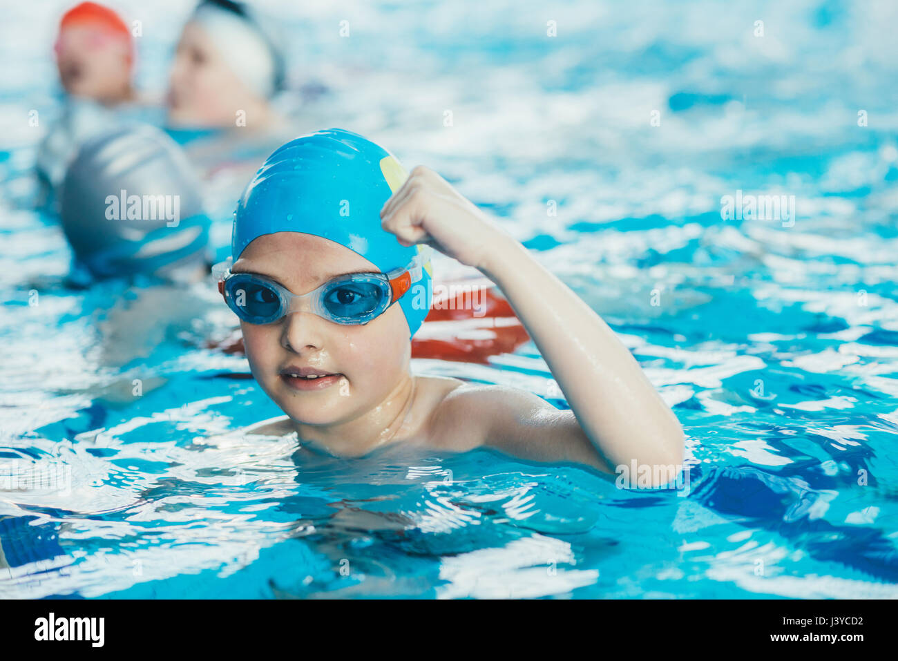 young and successful swimmers pose Stock Photo - Alamy