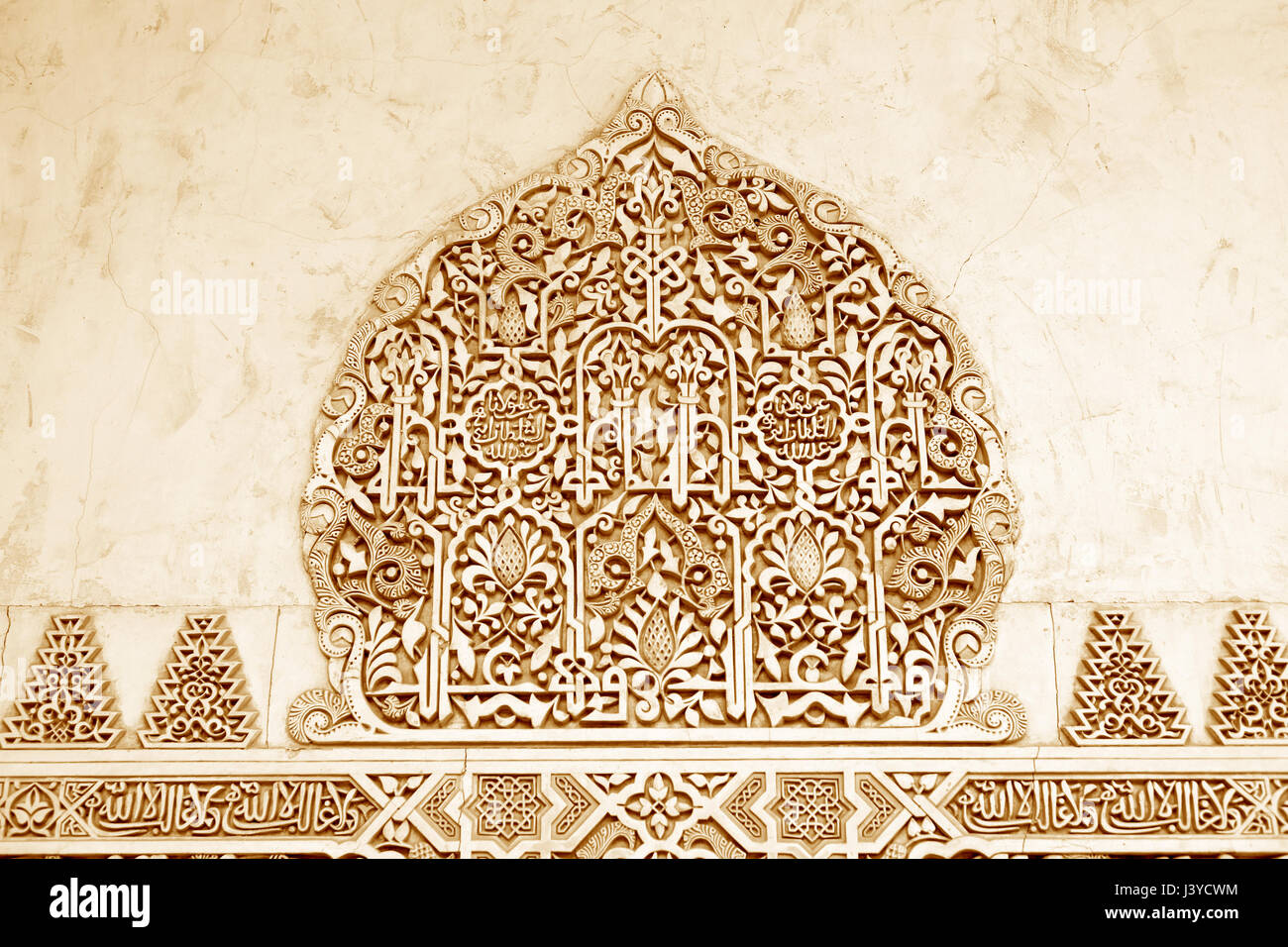 Ancient Arabian ornament on the palace wall in Alhambra. Granada, Spain ...