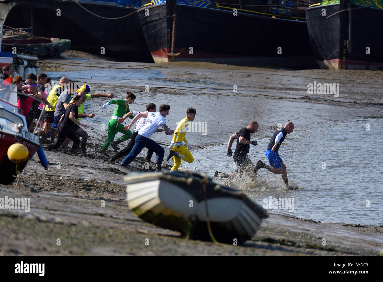 Mad Maldon Mud Race competitors run across mud and into the River ...