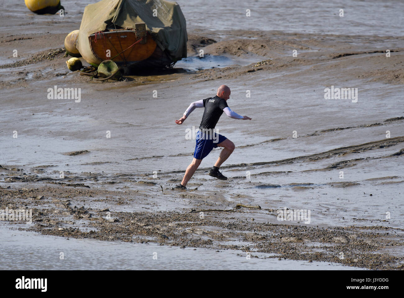 Solitary Mad Maldon Mud Race competitor covered in mud from racing ...