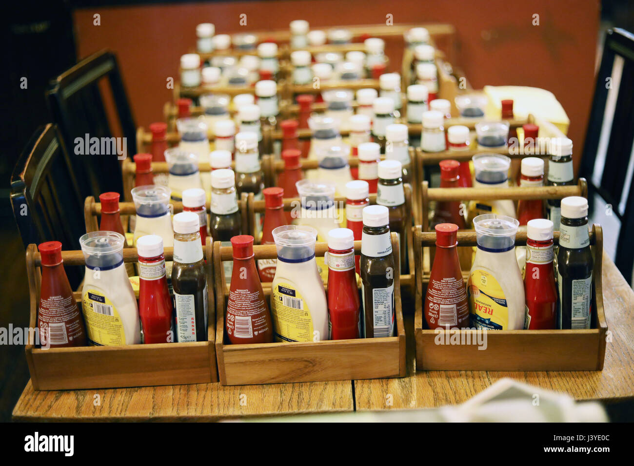 lots of sauce caddies in a pub Stock Photo - Alamy