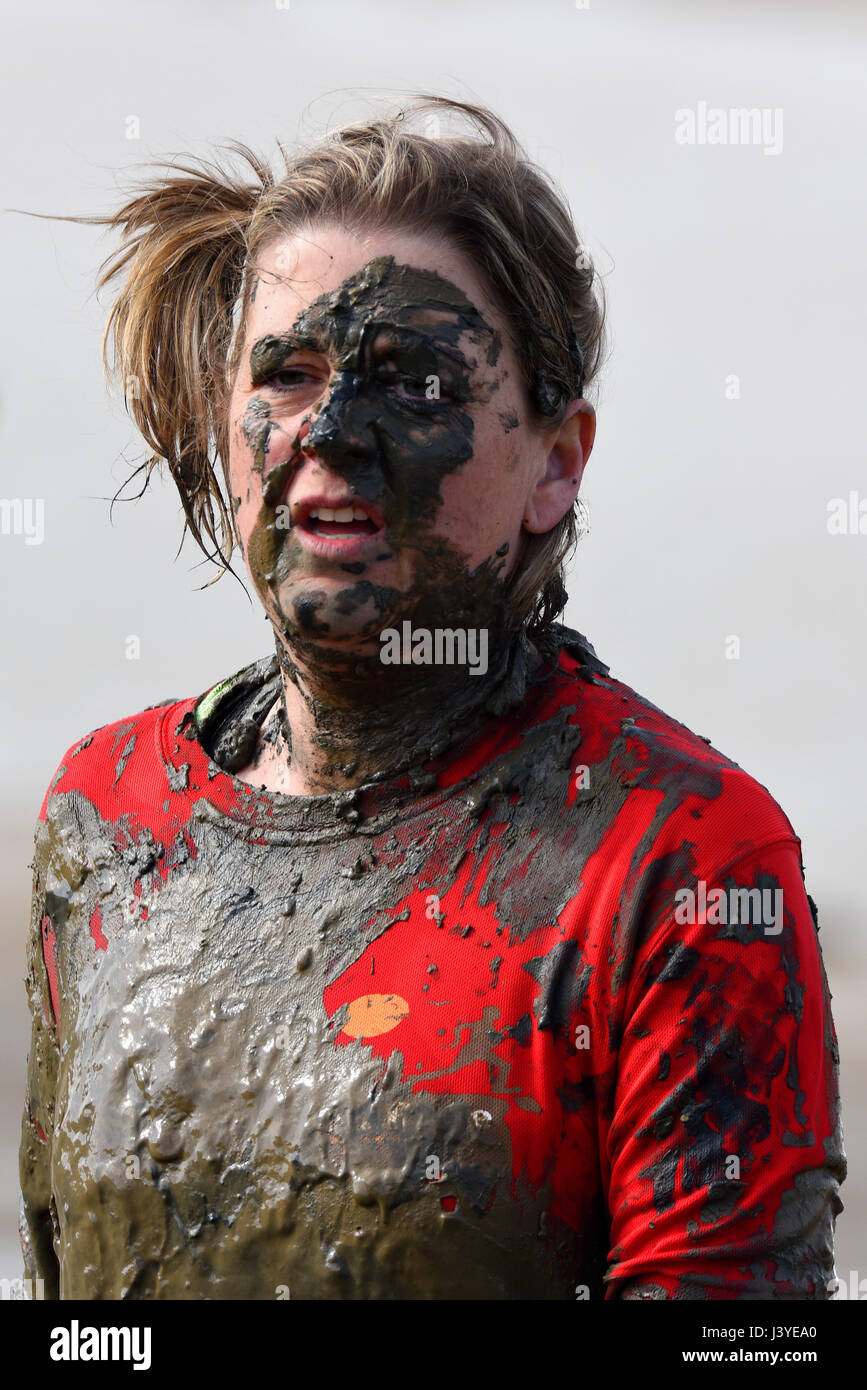 Mad Maldon Mud Race competitor covered in mud from racing through and ...